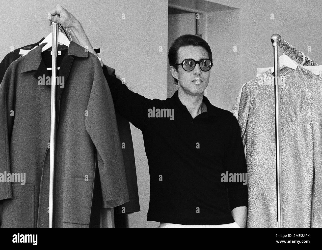 FILE - Women's clothing designer Halston poses among his designs at his ...