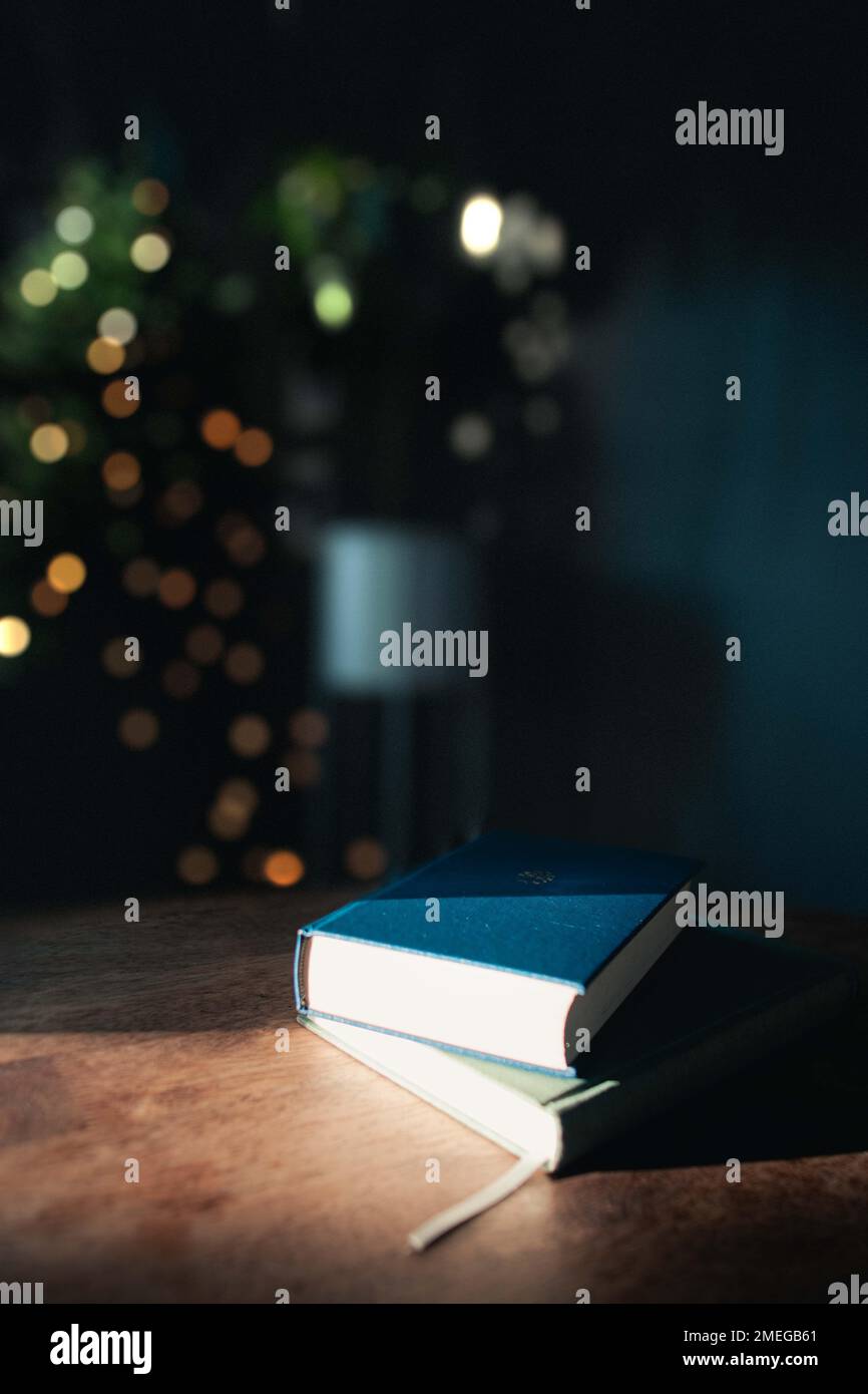 Study session books on table in afternoon light with teal blue ...