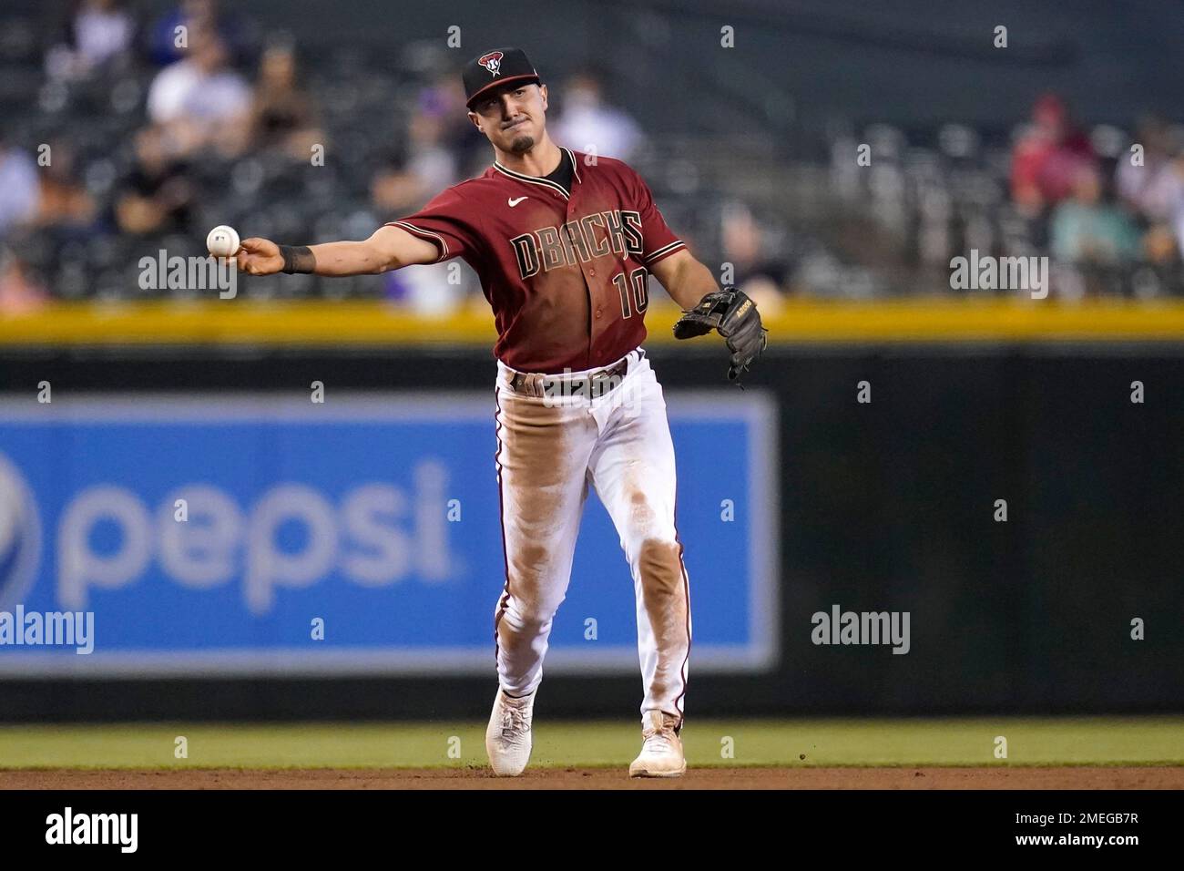 Arizona Diamondbacks second baseman Josh Rojas throws to first base for ...