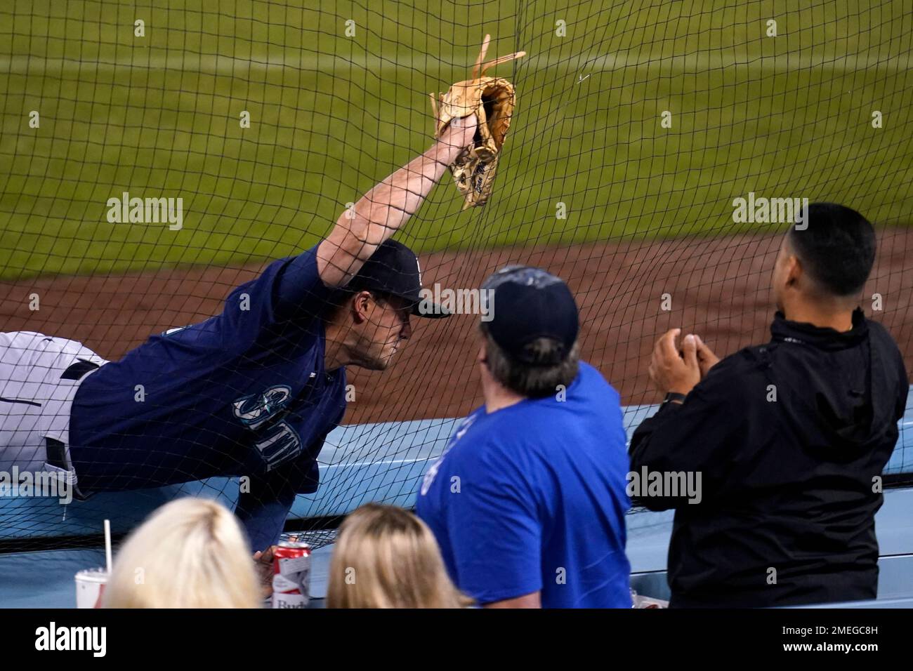 Seattle Mariners first baseman Evan White reaches for but can't catch a ...