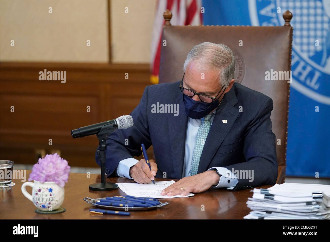 Washington Gov. Jay Inslee signs a bill into law, Wednesday, May 12 ...