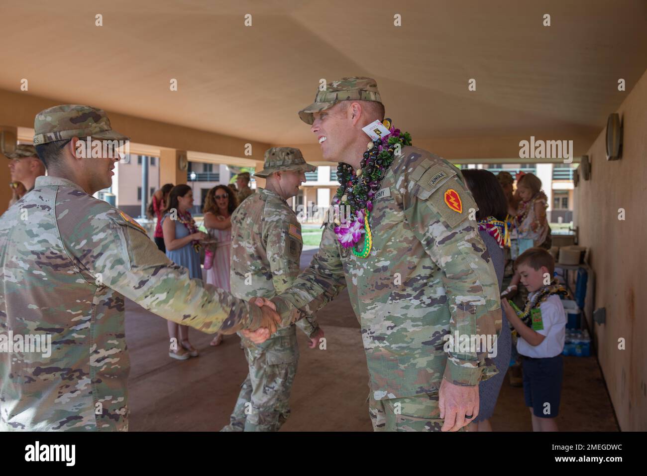 Command Sgt. Maj. Daniel Roney, right, receives congratulations after a ...