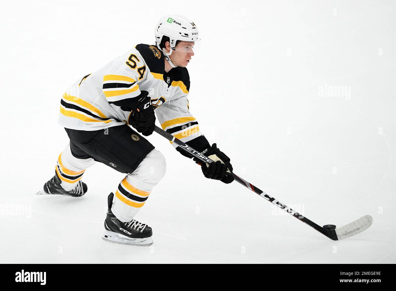 Boston Bruins defenseman Jack Ahcan (54) skates with the puck during ...