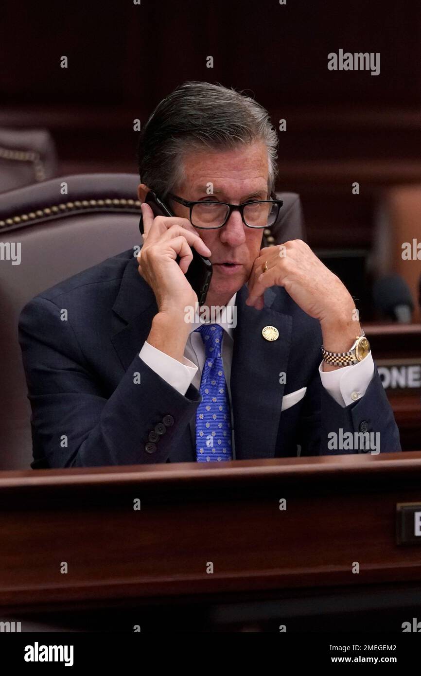 Florida Sen. Jim Boyd speaks on the phone during a break in a ...