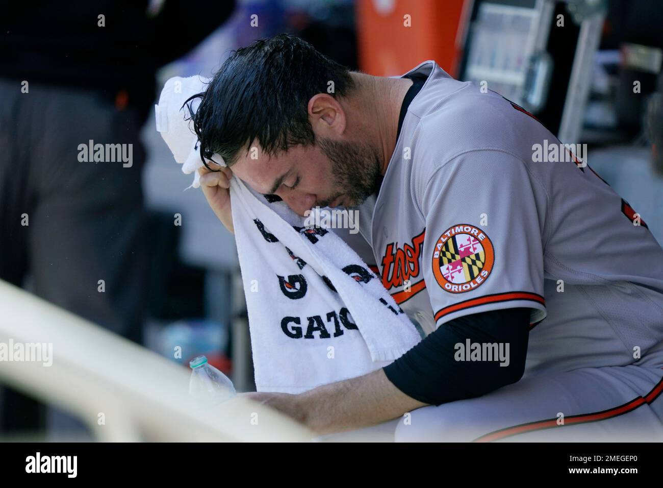 Baltimore Orioles starting pitcher Matt Harvey wipes his face with a ...