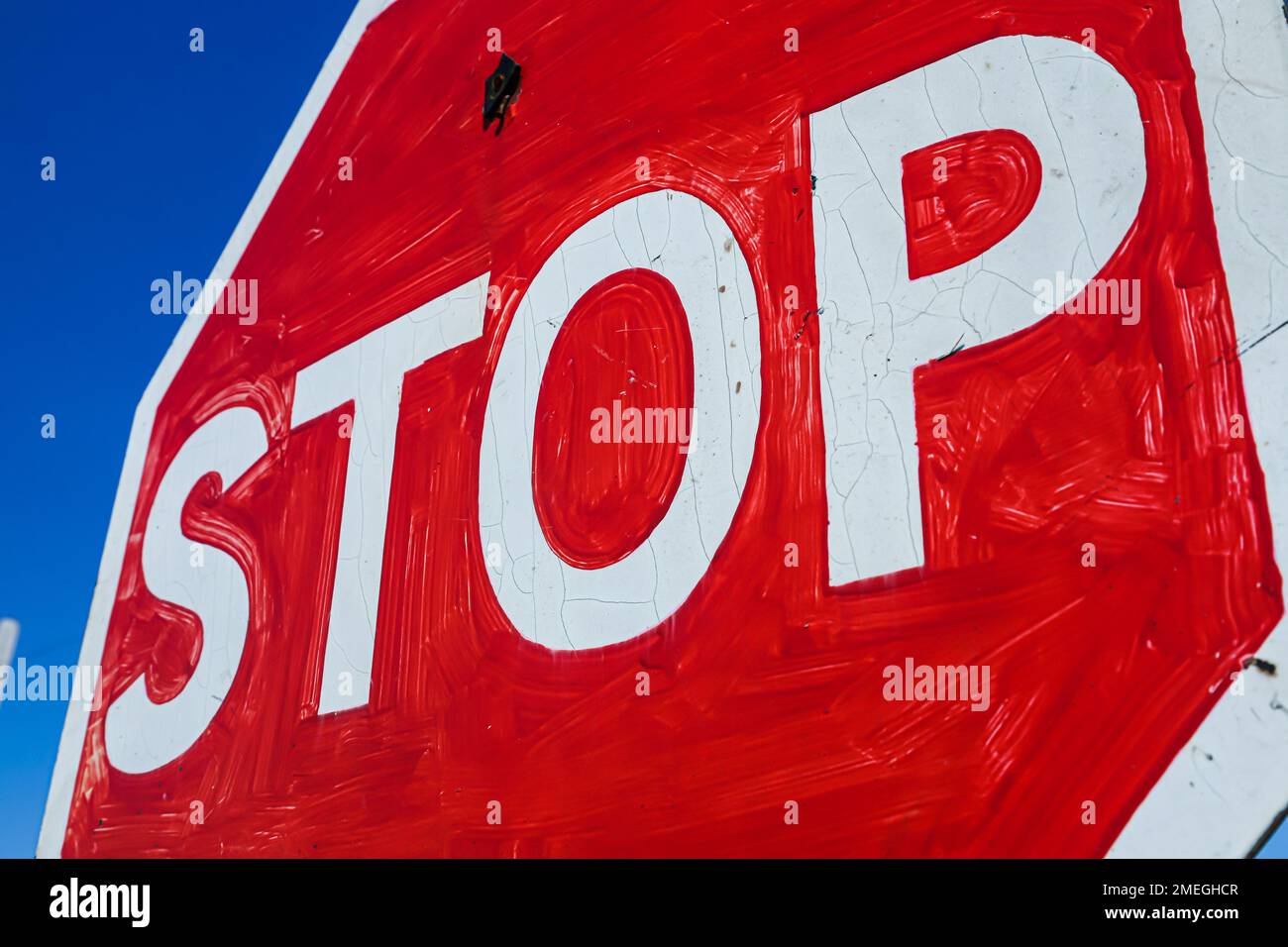 old stop sign on a background of blue sky with clouds Stock Photo - Alamy