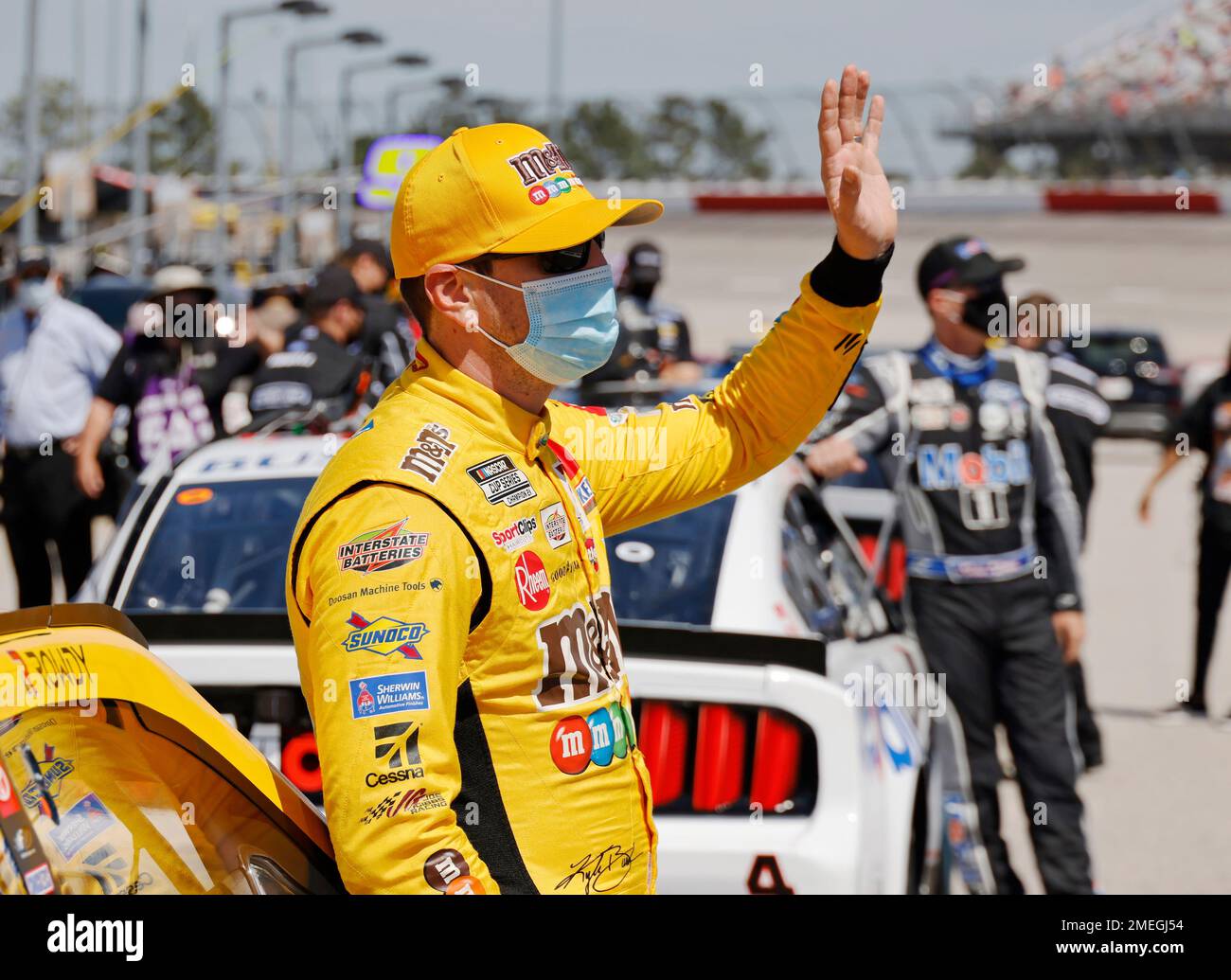 Kyle Busch waves to the crowd before the NASCAR Cup Series auto race at ...