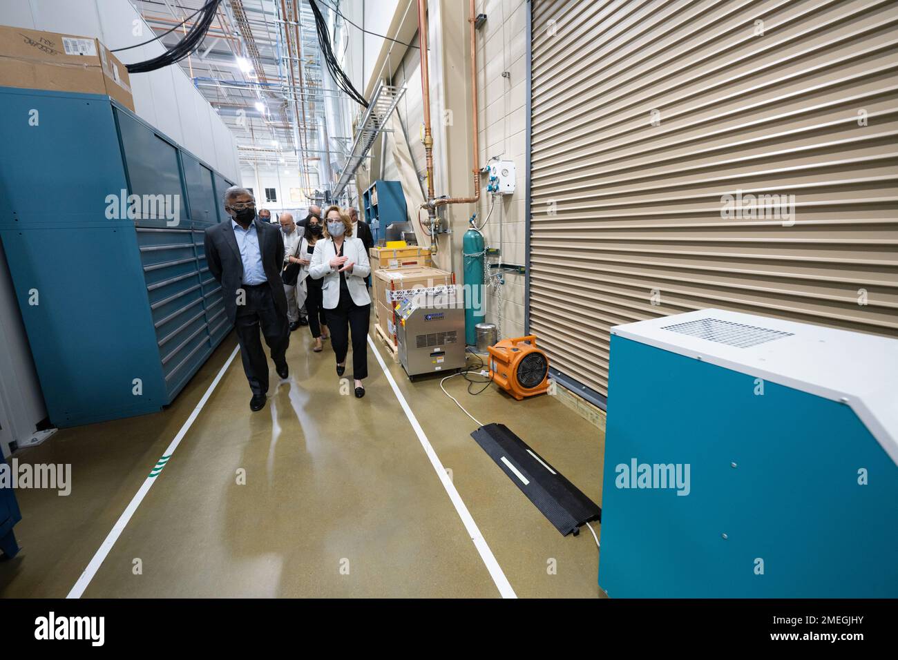 Deputy Secretary of Defense Kathleen Hicks walks with the director of ...