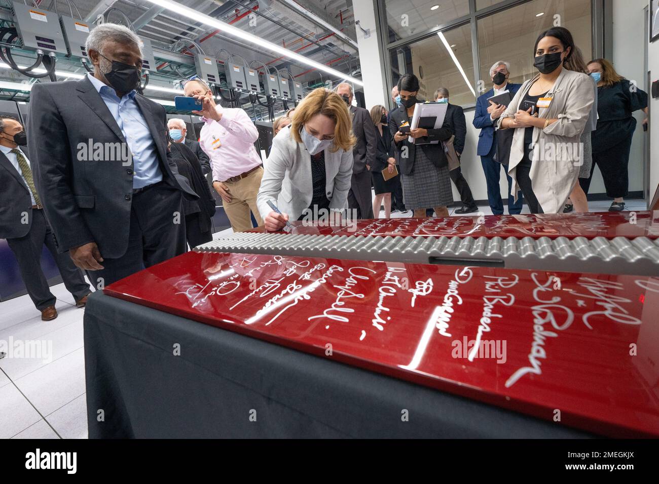 Deputy Secretary of Defense Kathleen Hicks adds her signature to a door ...