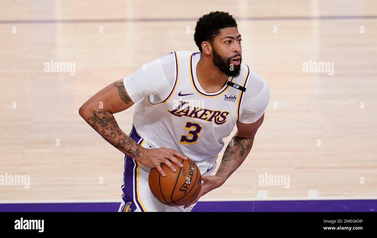 Los Angeles Lakers forward Anthony Davis holds the ball during an NBA ...