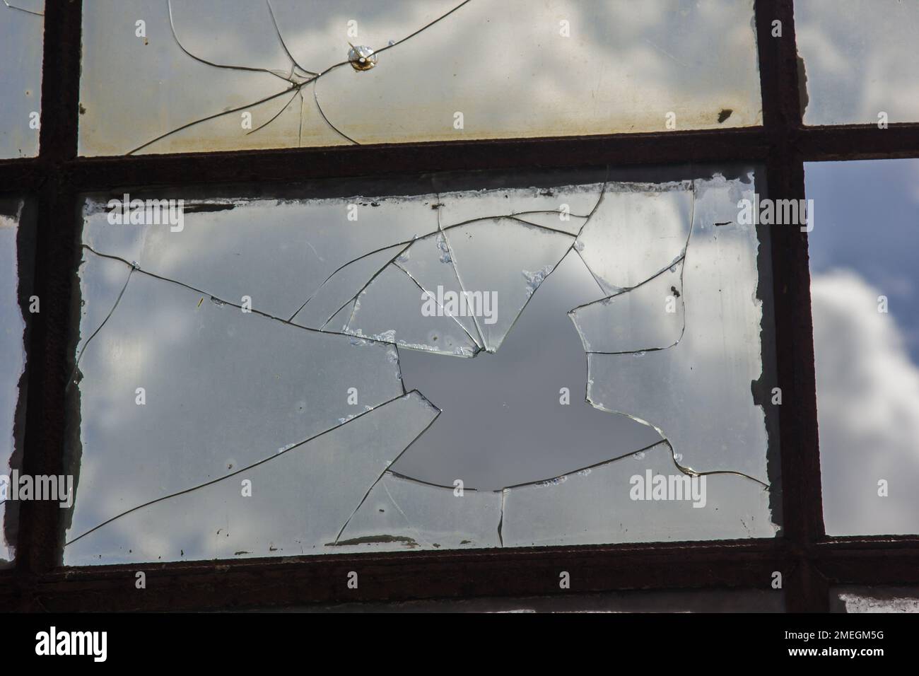 broken glass in the window. background sky, danger, devastation Stock ...