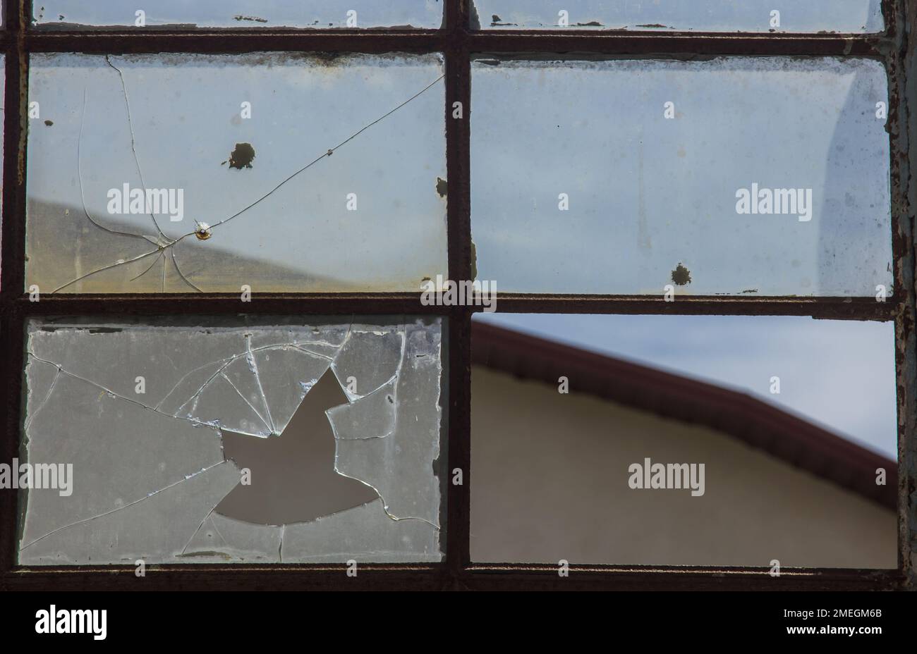 broken glass in the window. background sky, danger, devastation Stock ...