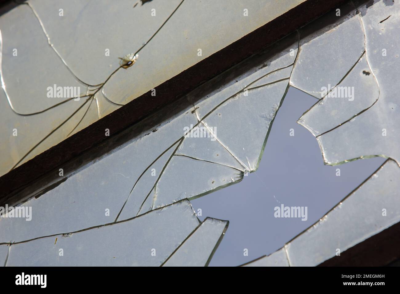 broken glass in the window. background sky, danger, devastation Stock ...