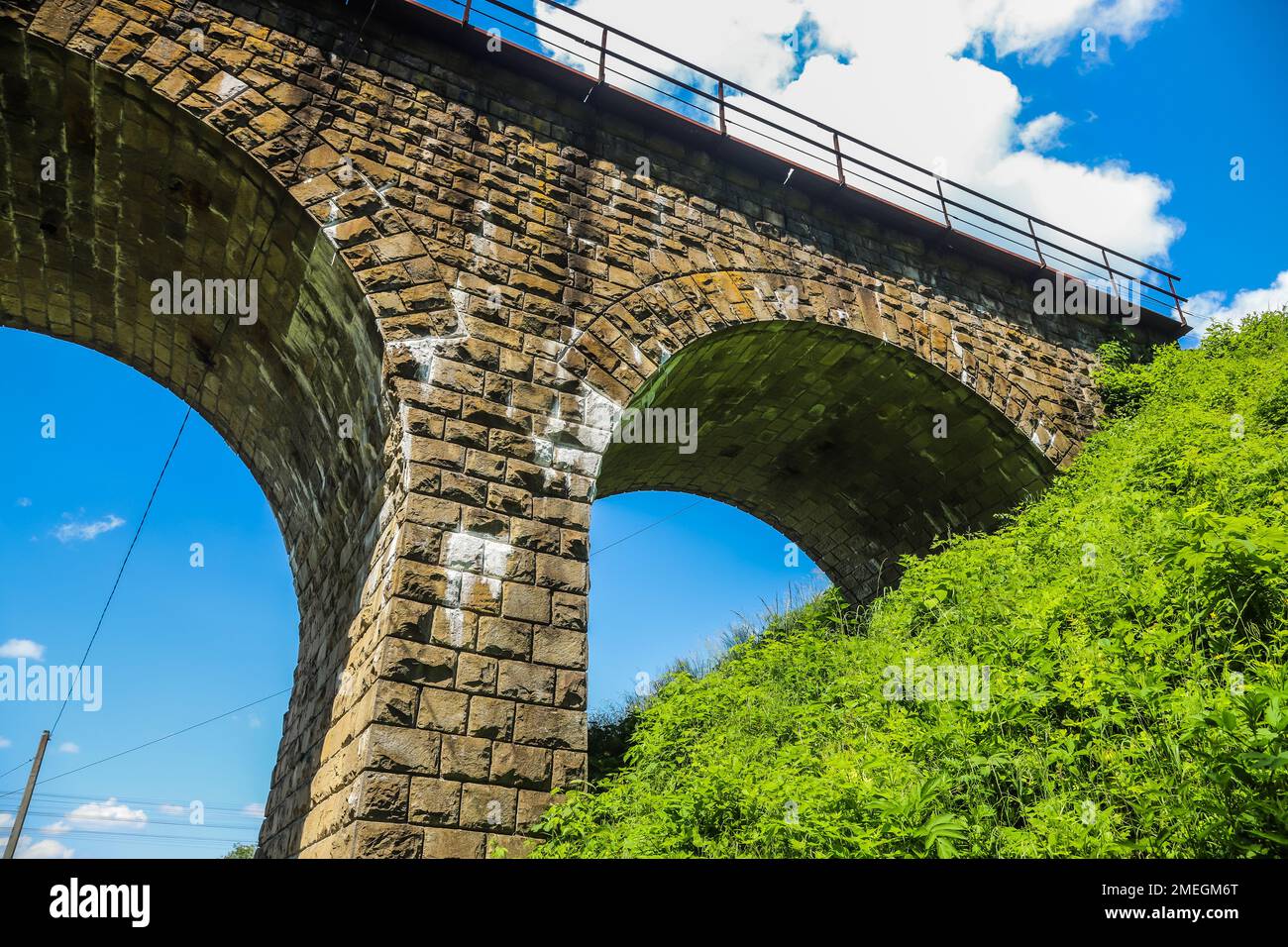 the old railway bridge is built of stone. historic building used Stock ...