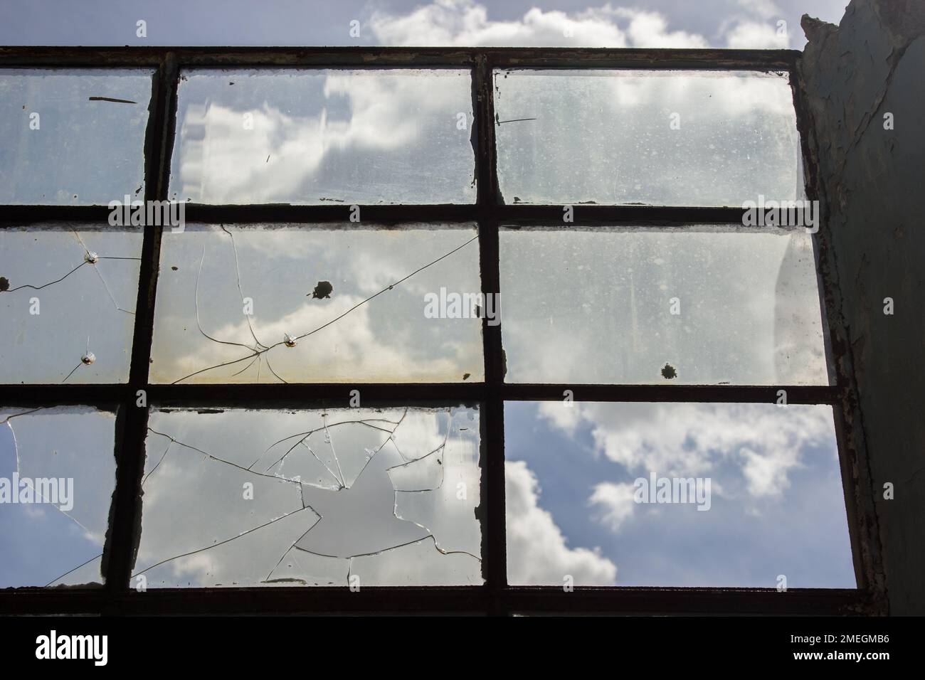 broken glass in the window. background sky, danger, devastation Stock ...