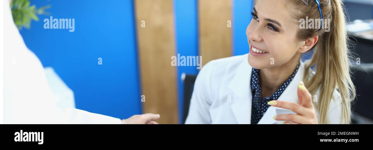 Physician scientists colleagues smile and communicate in laboratory ...