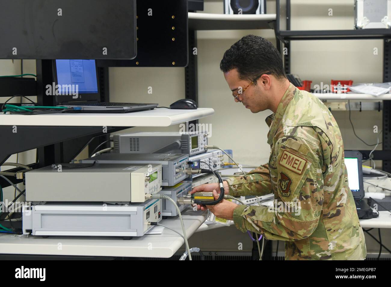 Airman 1st Class Carlos Quiles Melendez, a precision measurement ...