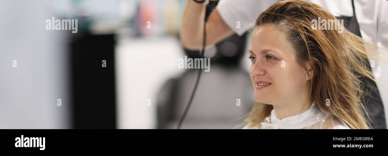 Hair styling process in beauty salon with hair dryer Stock Photo - Alamy