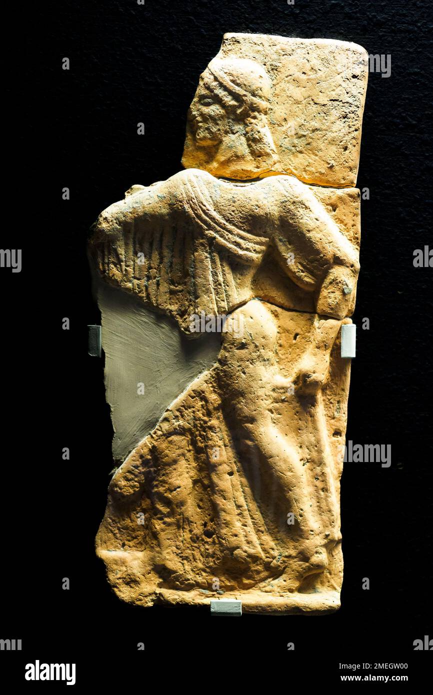Young woman in long chiton to left with head and legs in profile and 3/ ...