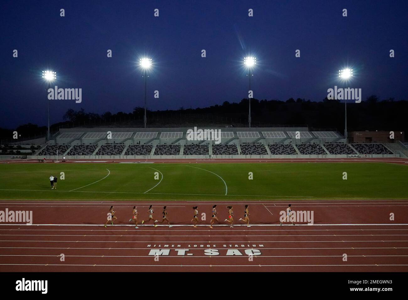 Athletes compete in the women's 5000-meter run during the USATF Golden ...