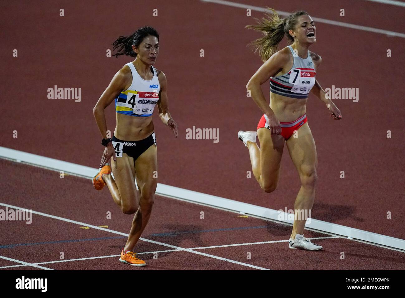 Laura Galvan Rodriguez, left, and Julie-Anne Staehli cross the finish ...