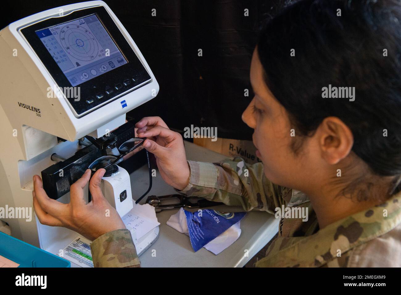 U.S. Army Spc. Joanna Rodriguez, an optician with the Naval Ophthalmic ...