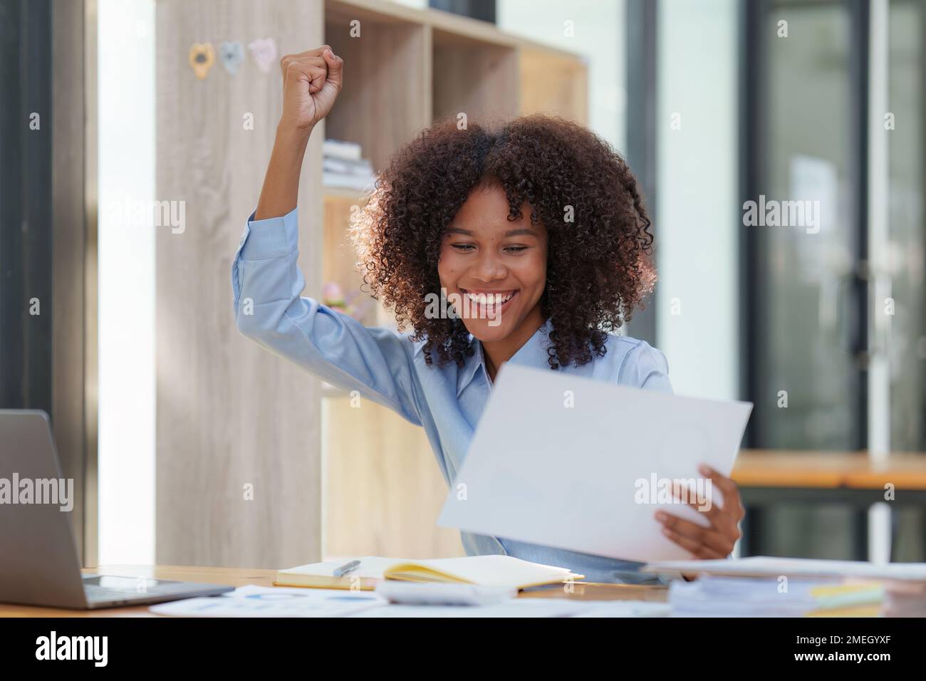 Black businesswoman work on laptop feel euphoric winning. Excited ...