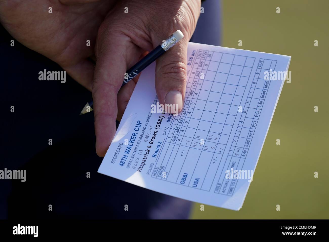 A fan hols a scorecard in the foursome matches during the Walker Cup ...