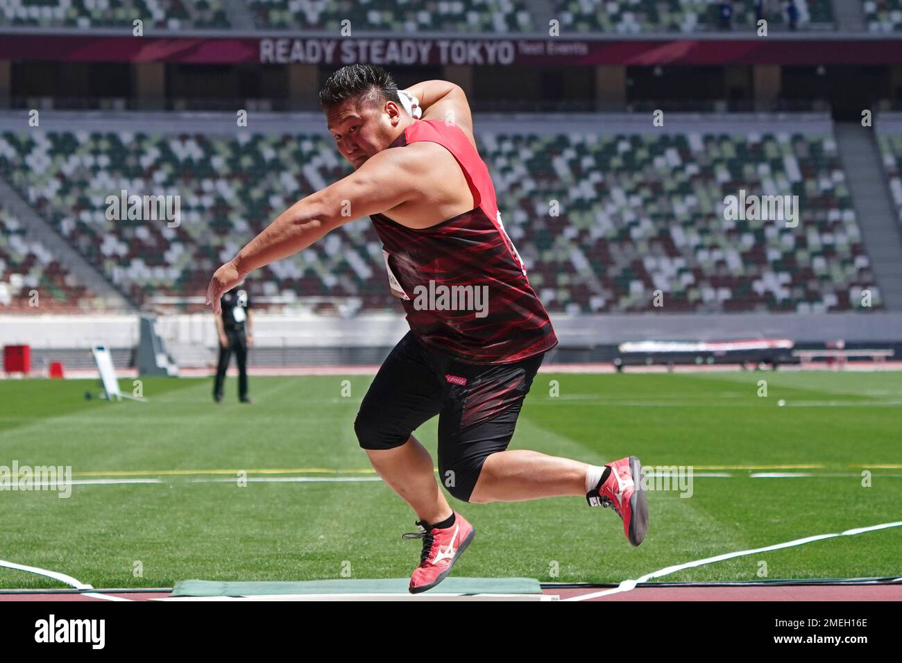 Japanese Daichi Nakamura performs a shot put at an athletics test event ...