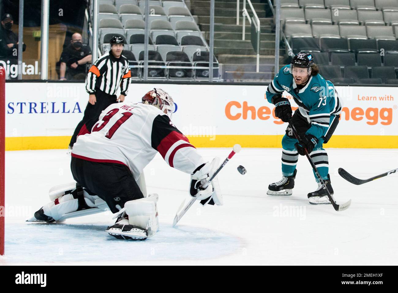Arizona Coyotes goaltender Adin Hill (31) blocks a shot by San Jose ...