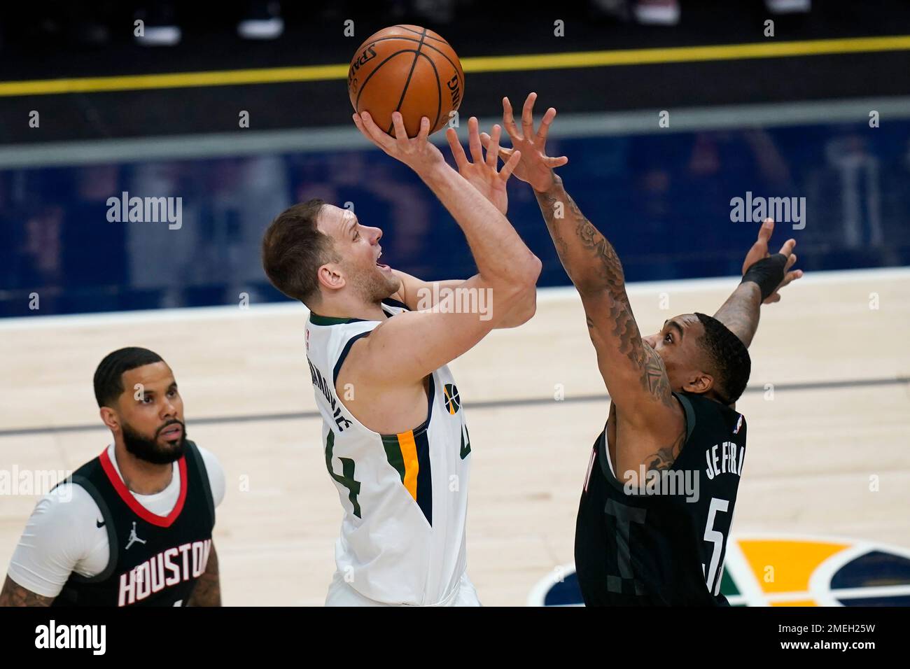 Utah Jazz forward Bojan Bogdanovic, center, shoots as Houston Rockets ...