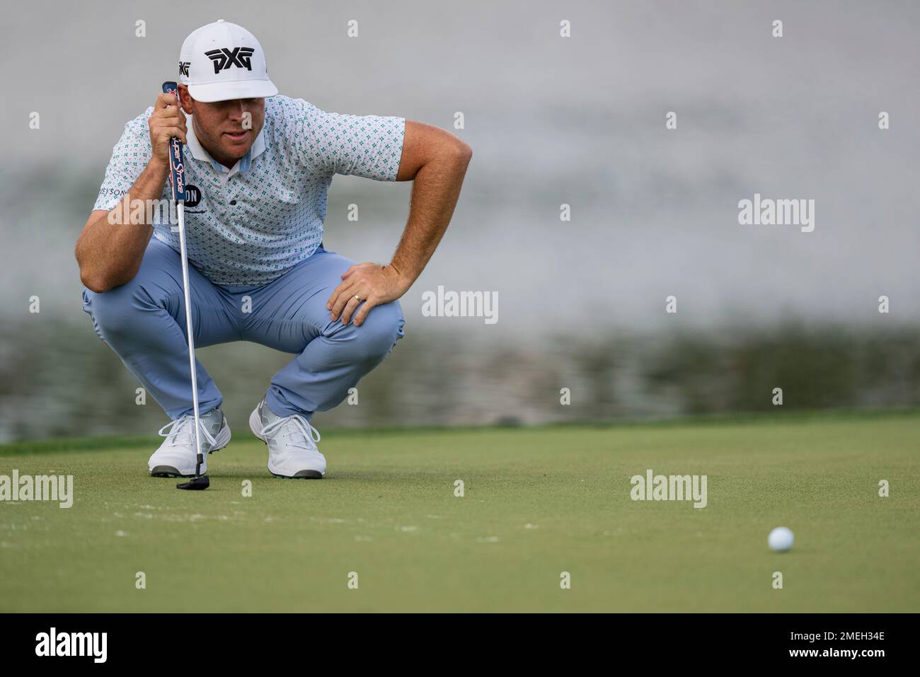 Luke List lines up his putt on the 17th hole during the third round of ...