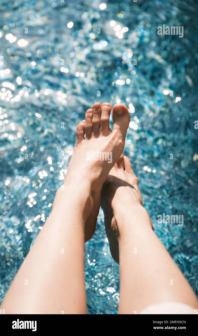 Legs In The Pool Stock Photo - Alamy