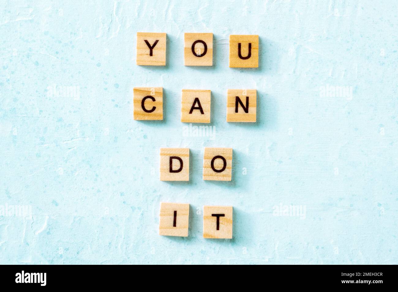You can do it, motivational banner with letters on a blue background ...
