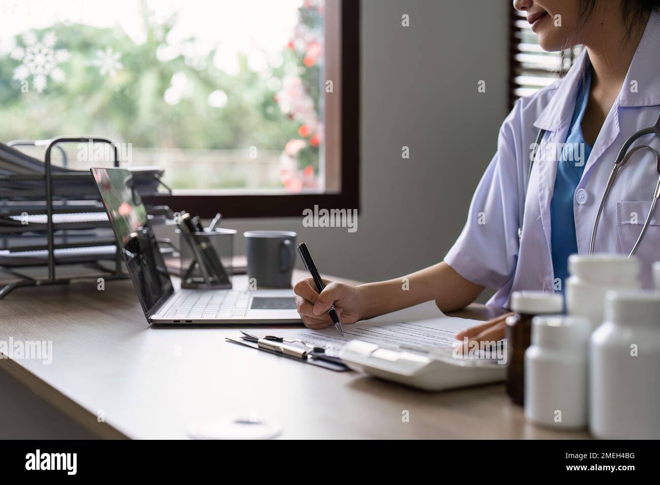 Doctor holding digital tablet at clinic. Medical technology concept ...