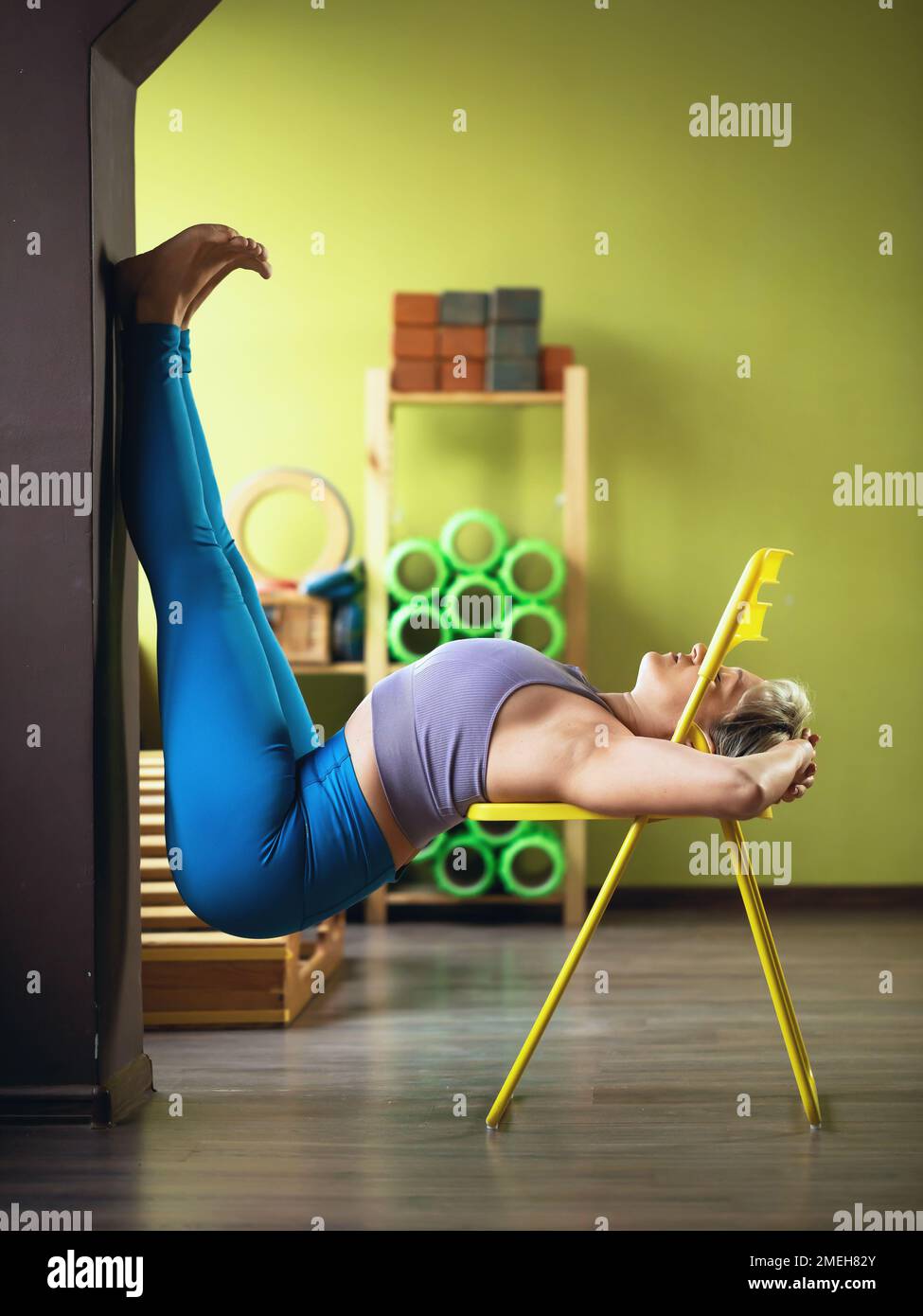 A woman leading a healthy lifestyle and practicing yoga, performs a ...