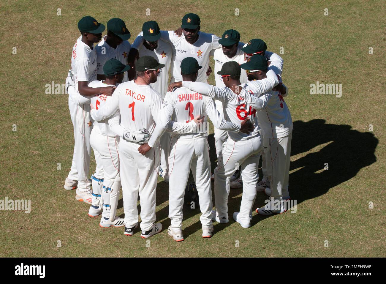 Zimbabwean players huddle together before going on the pitch during the ...