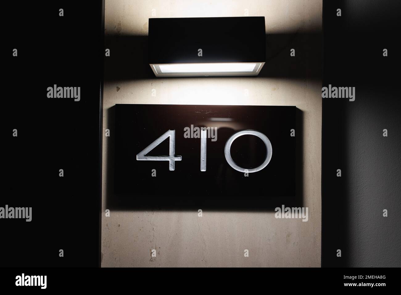 Plastic Sign with a Hotel Room Number Overwritten on it Stock Photo - Alamy