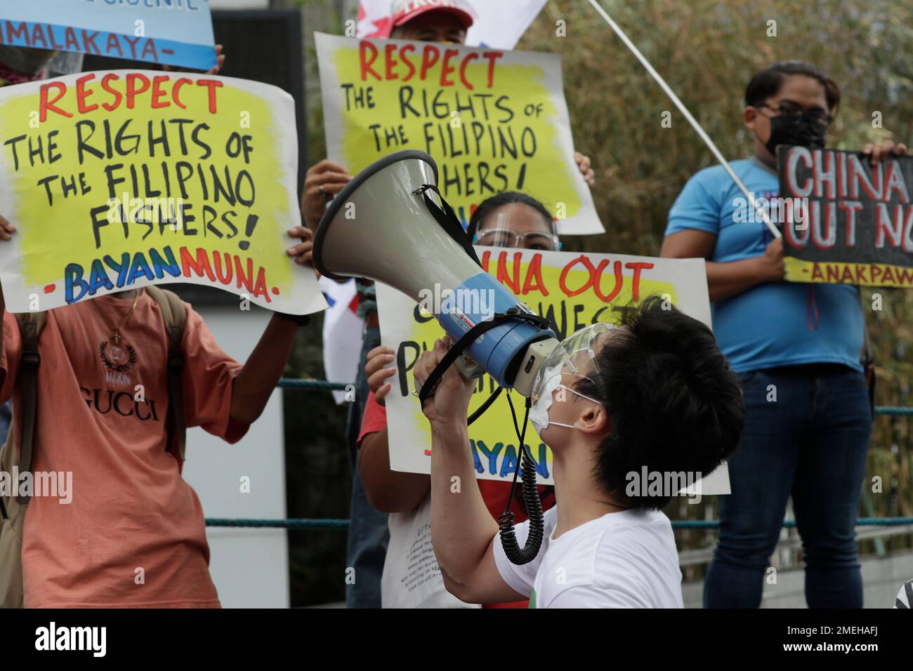 A protester shouts slogans during a rally outside the Chinese consulate ...