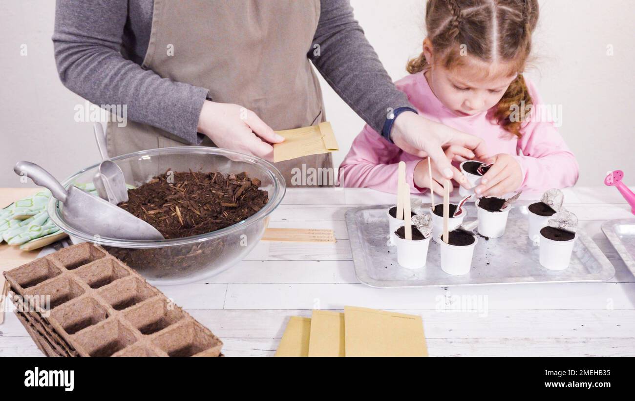 Black girl planting seeds hi-res stock photography and images - Alamy