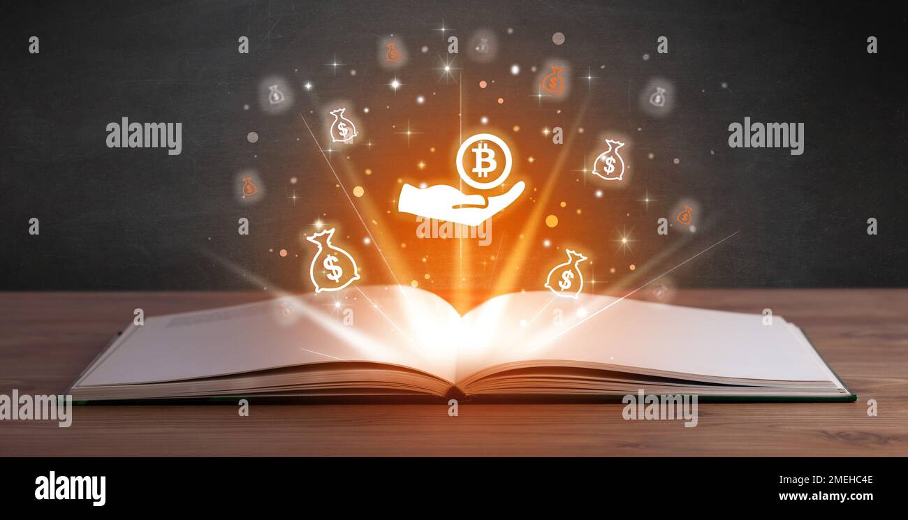 Open book with currency icons above Stock Photo - Alamy