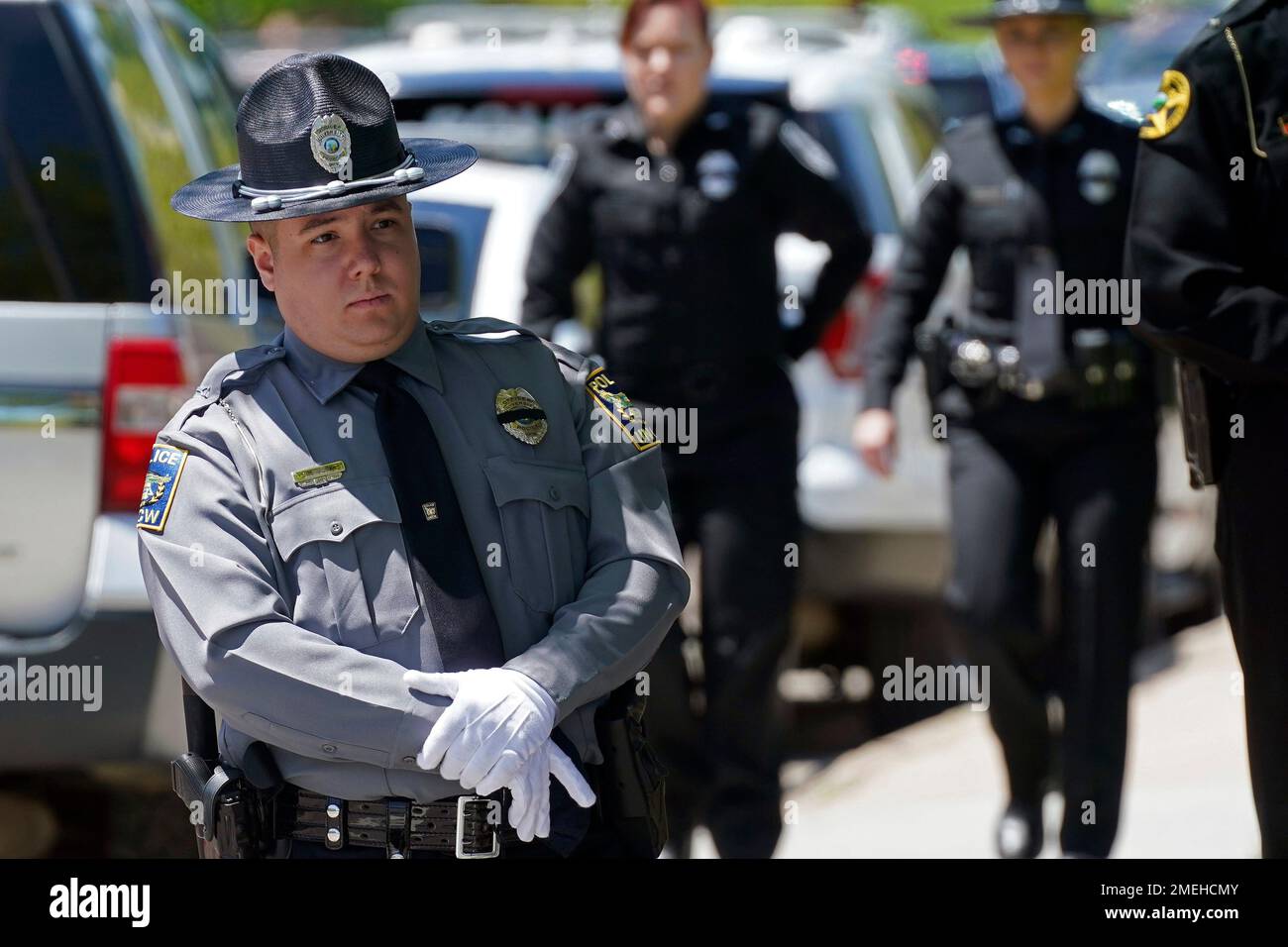 A police officer waits outside the Holmes Convocational Center for the ...