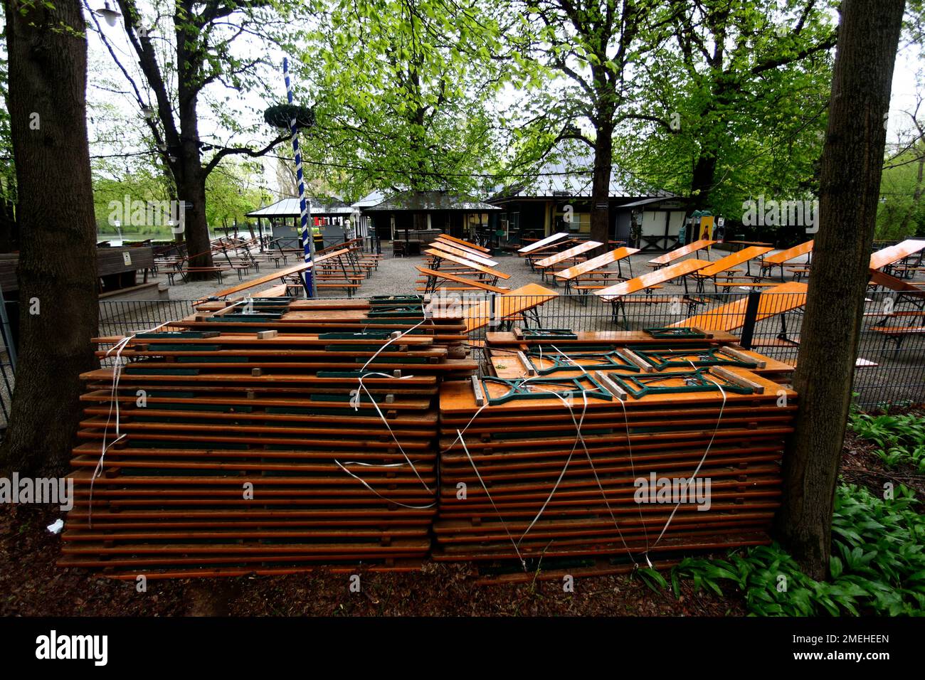 Stacked tables and benches lie at the closed beer garden 'Seehaus' in Munich, Germany, Thursday ...