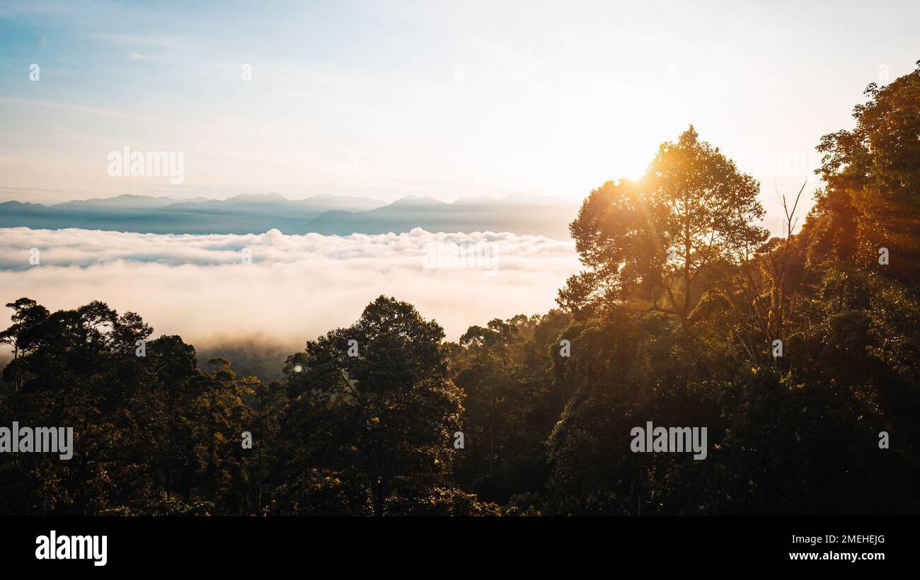 Sea clouds during golden sunrise above the Titiwangsa range mountains ...