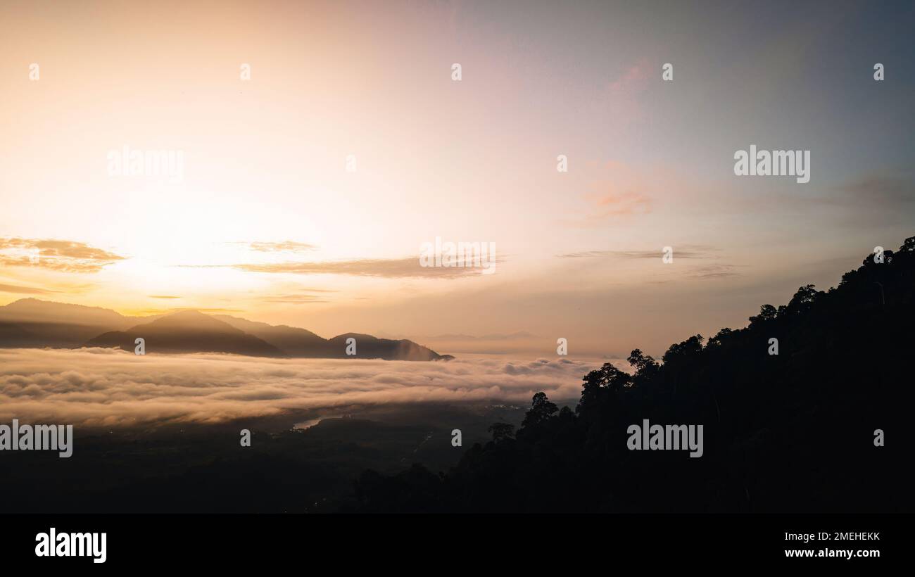 Sea clouds during golden sunrise above the Titiwangsa range mountains ...