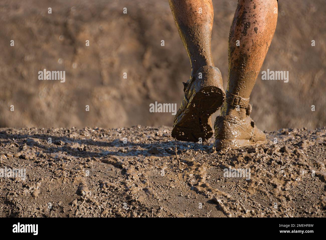 Mud race runners, detail of the legs Stock Photo - Alamy