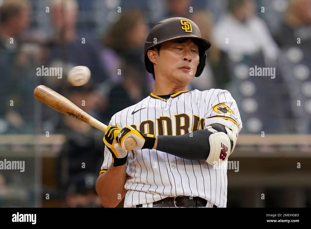 San Diego Padres' Ha-Seong Kim moves back from an inside pitch while ...