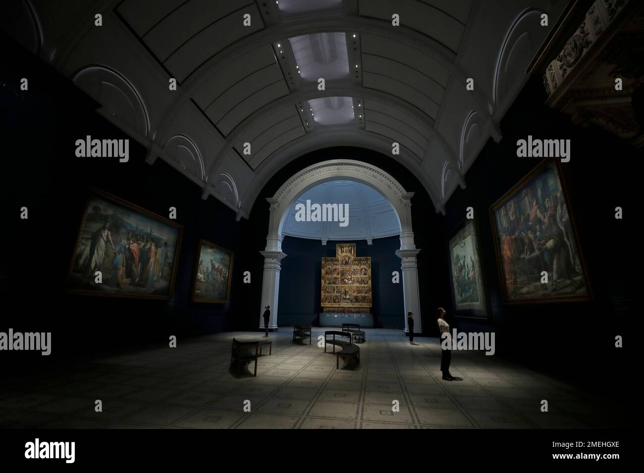 Staff members pose for photographs by the Raphael Cartoons, which began ...