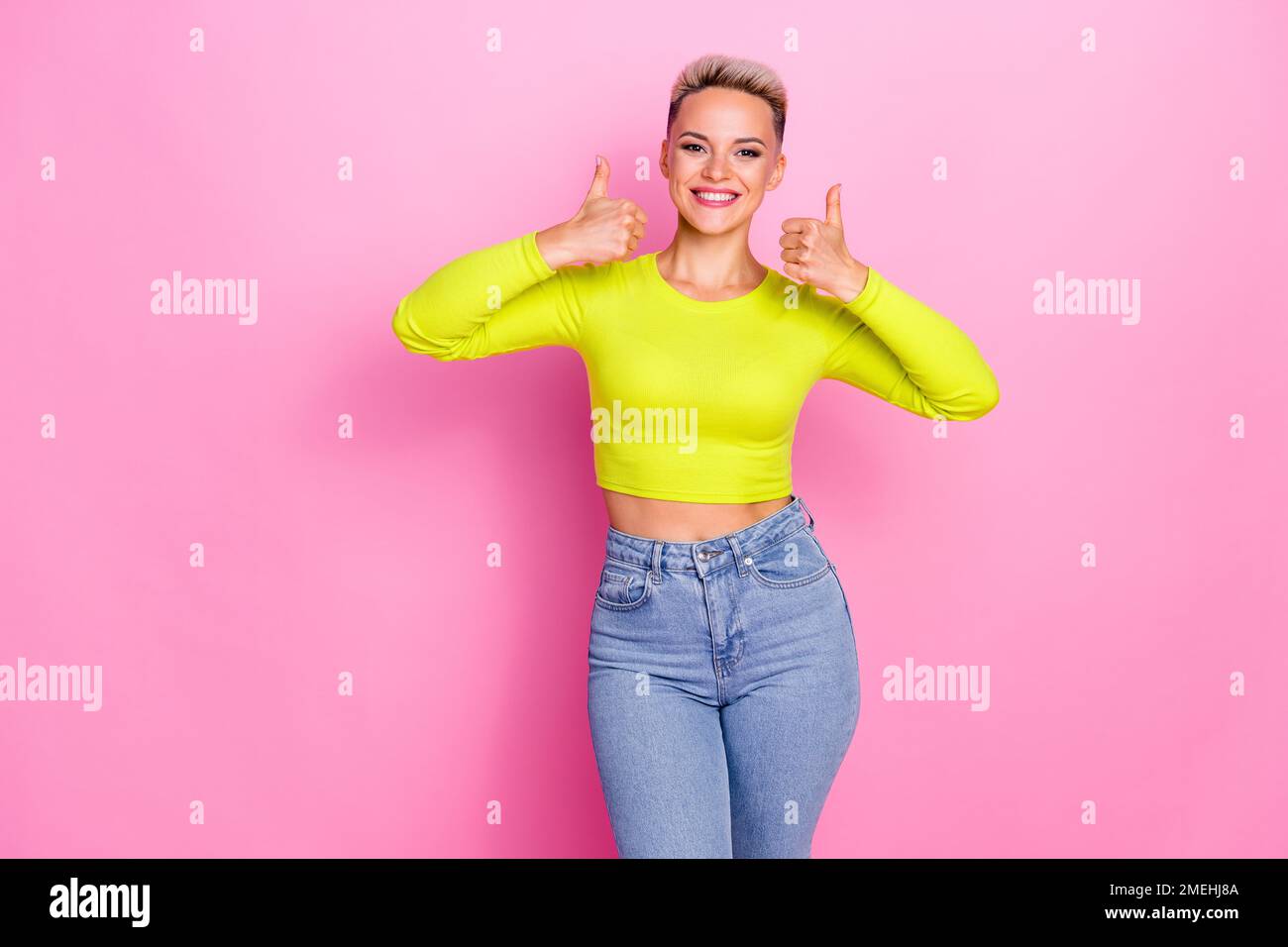 Photo of charming positive girl toothy smile demonstrate thumb up ...