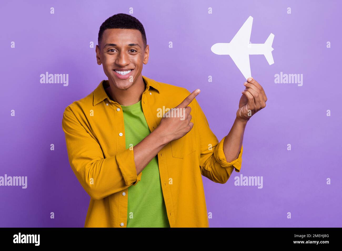 Portrait of handsome cheerful optimistic guy wear yellow clothes ...